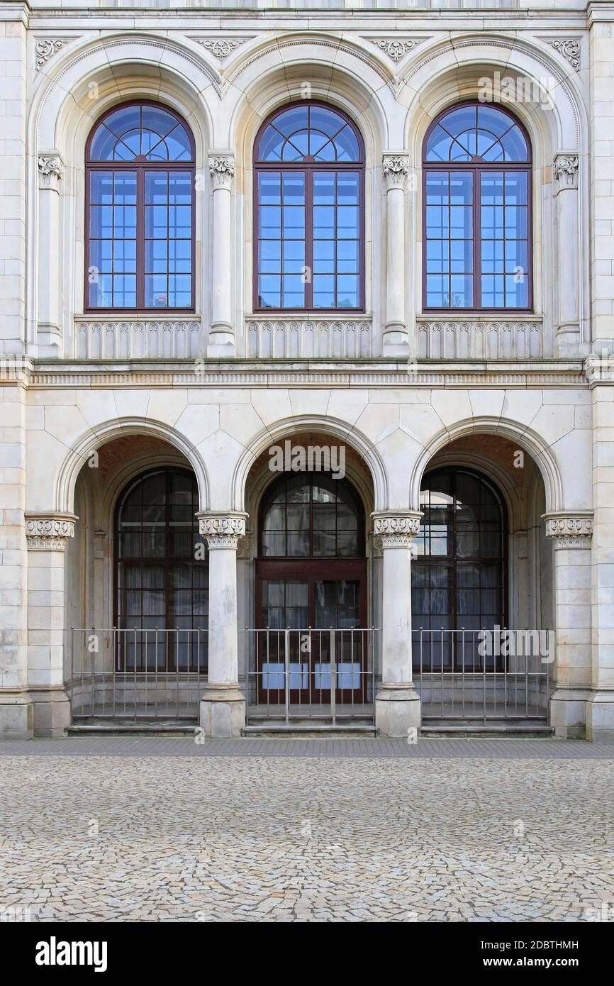 Building exterior with three arches in classic style Stock Photo - Alamy