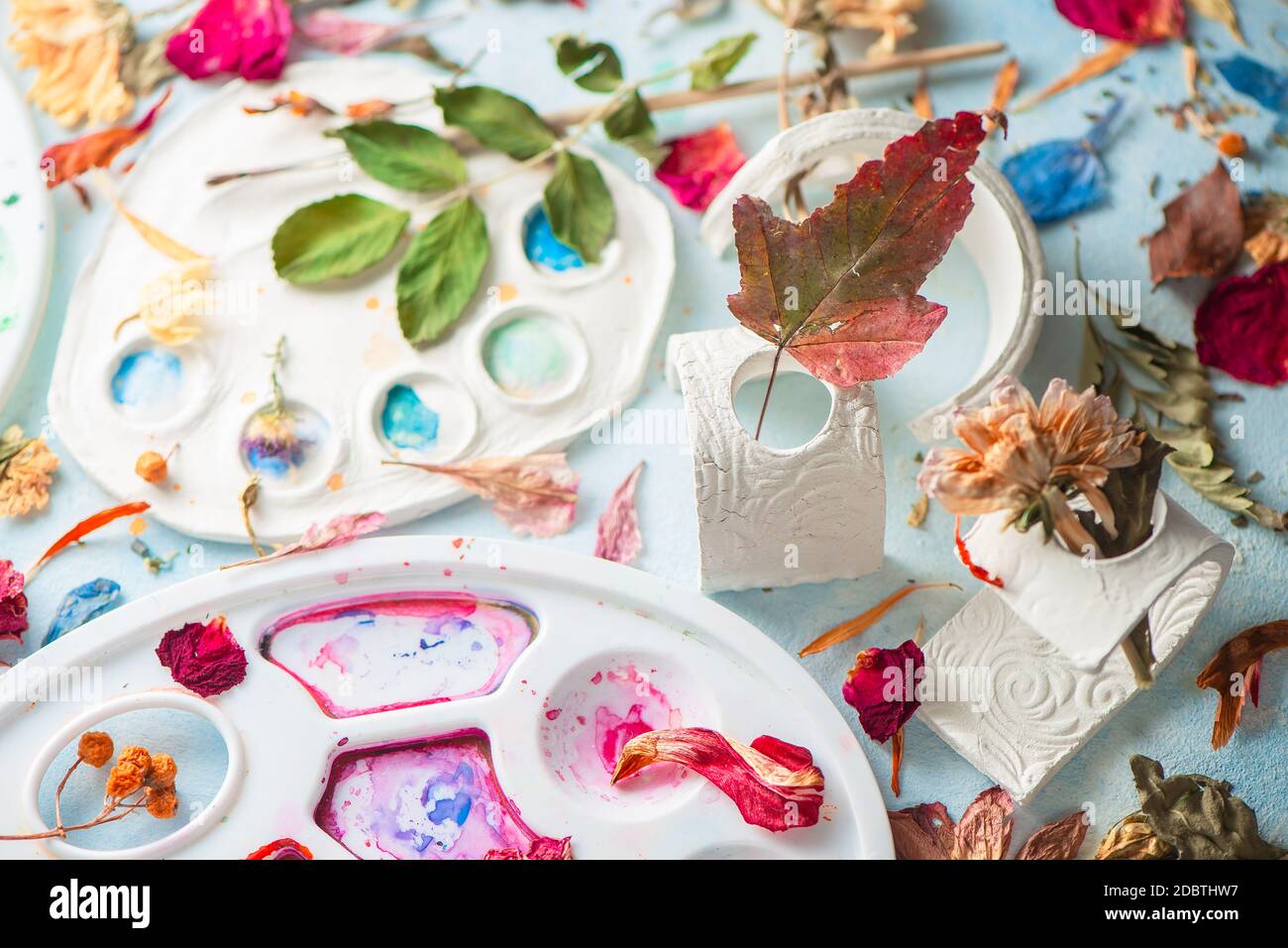 Art botany flat lay with watercolor palettes, leaves and petals, nature ...
