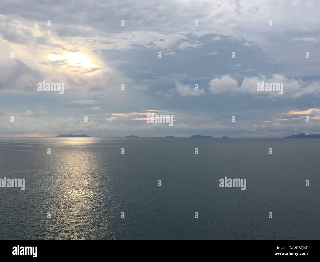 sunrise over the sea on a cloudy day in asia Stock Photo - Alamy