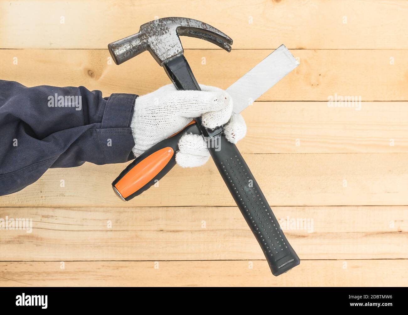 Hand holding chisel hammer hi-res stock photography and images - Alamy