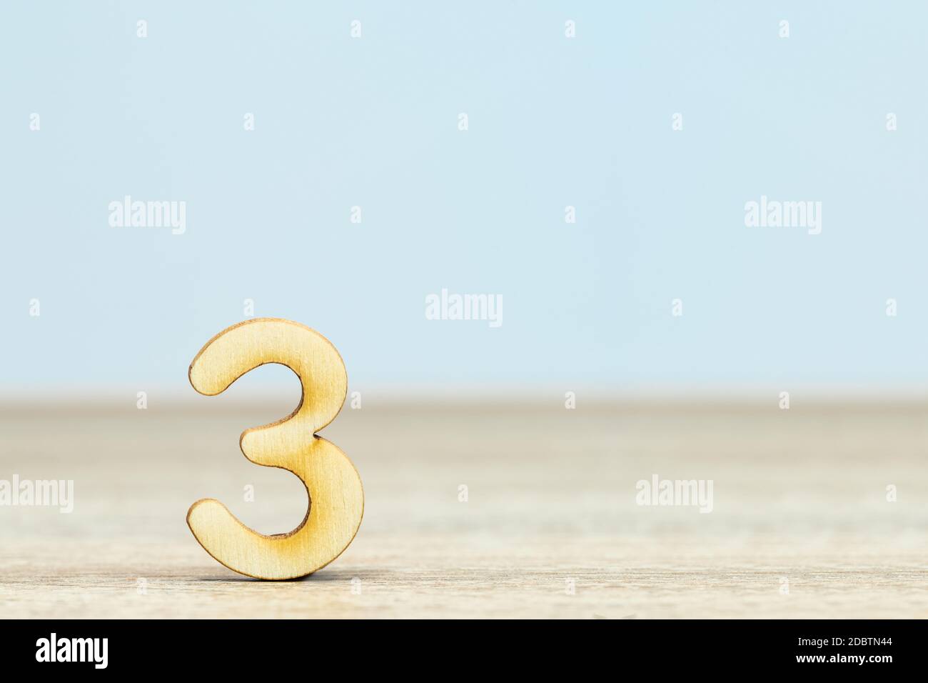 Close up wooden numeric on table with copy space, number three Stock ...