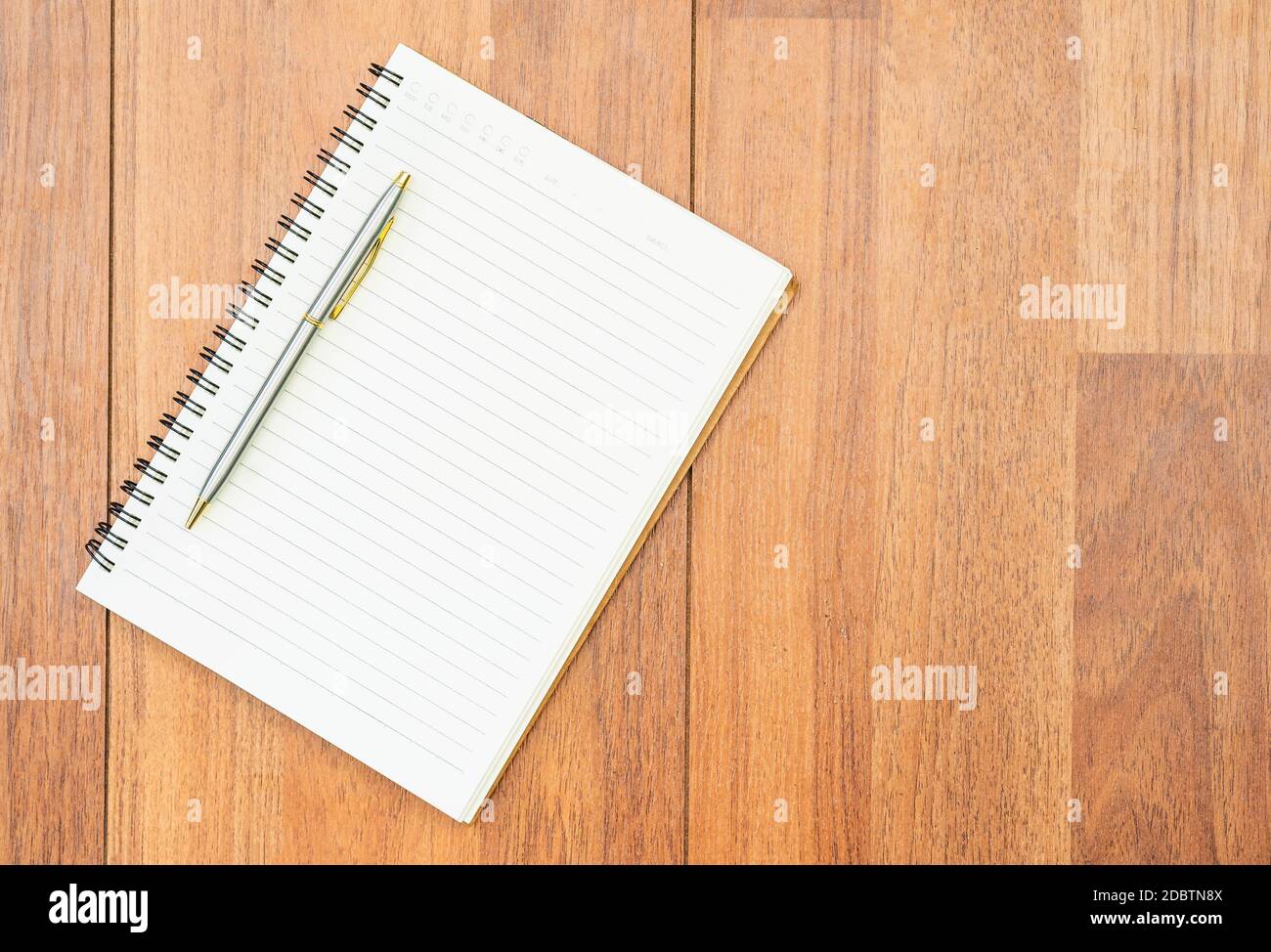Top view pen and notepad on wood deck with copyspace Stock Photo - Alamy