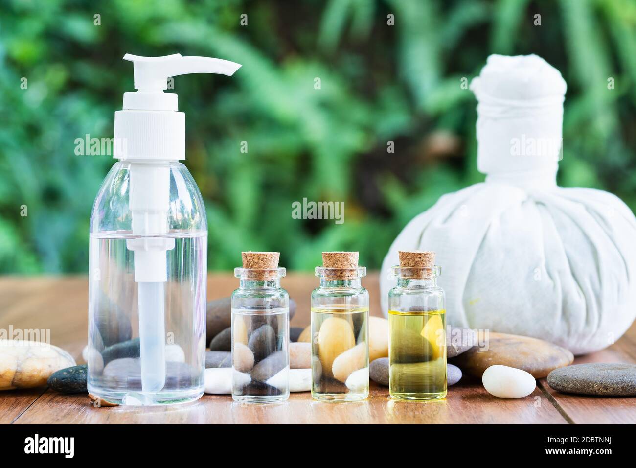 Thai Spa massage setting with bottle with essential oil and thai herbal ...