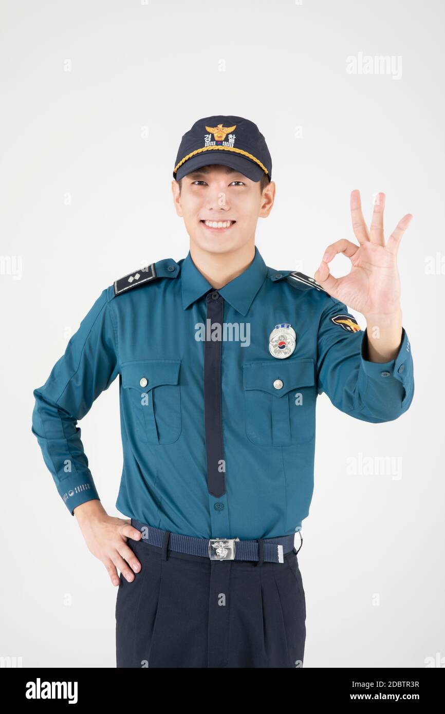 Asian male and female two police officers 013 Stock Photo - Alamy