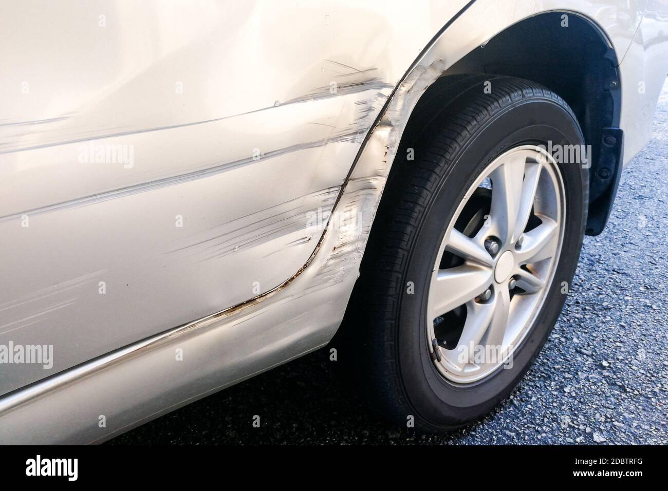 Car with minor dent and scratch due to accident Stock Photo - Alamy