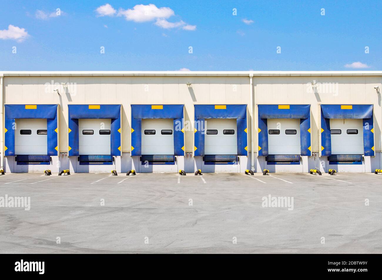 Front view of big warehouse loading dock Stock Photo - Alamy