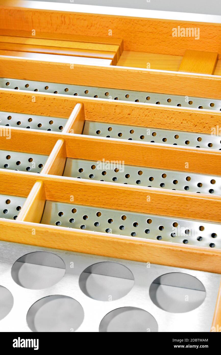 Close up shot of perforated drawer rack Stock Photo - Alamy