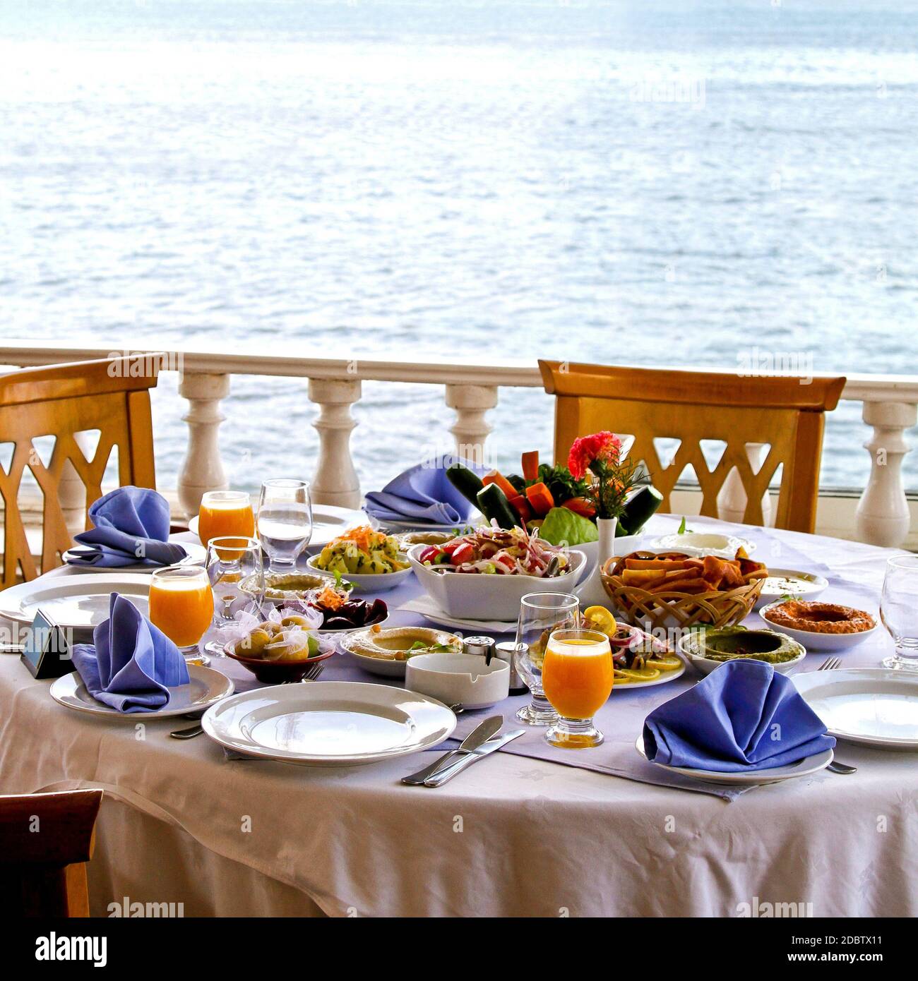 Elegant set up table with tasty food Stock Photo - Alamy