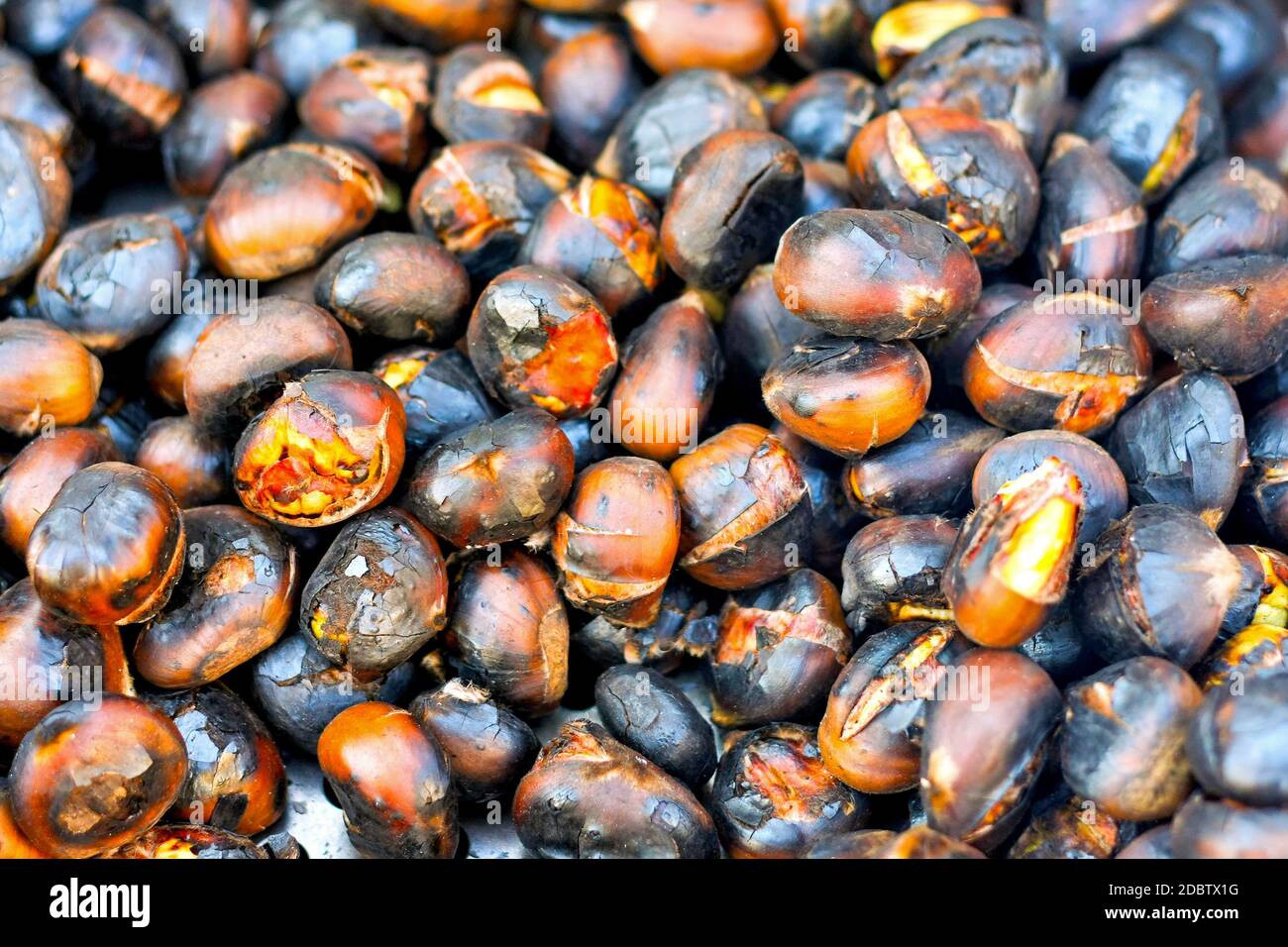 Pile of roasted chestnuts on a street stall Stock Photo - Alamy