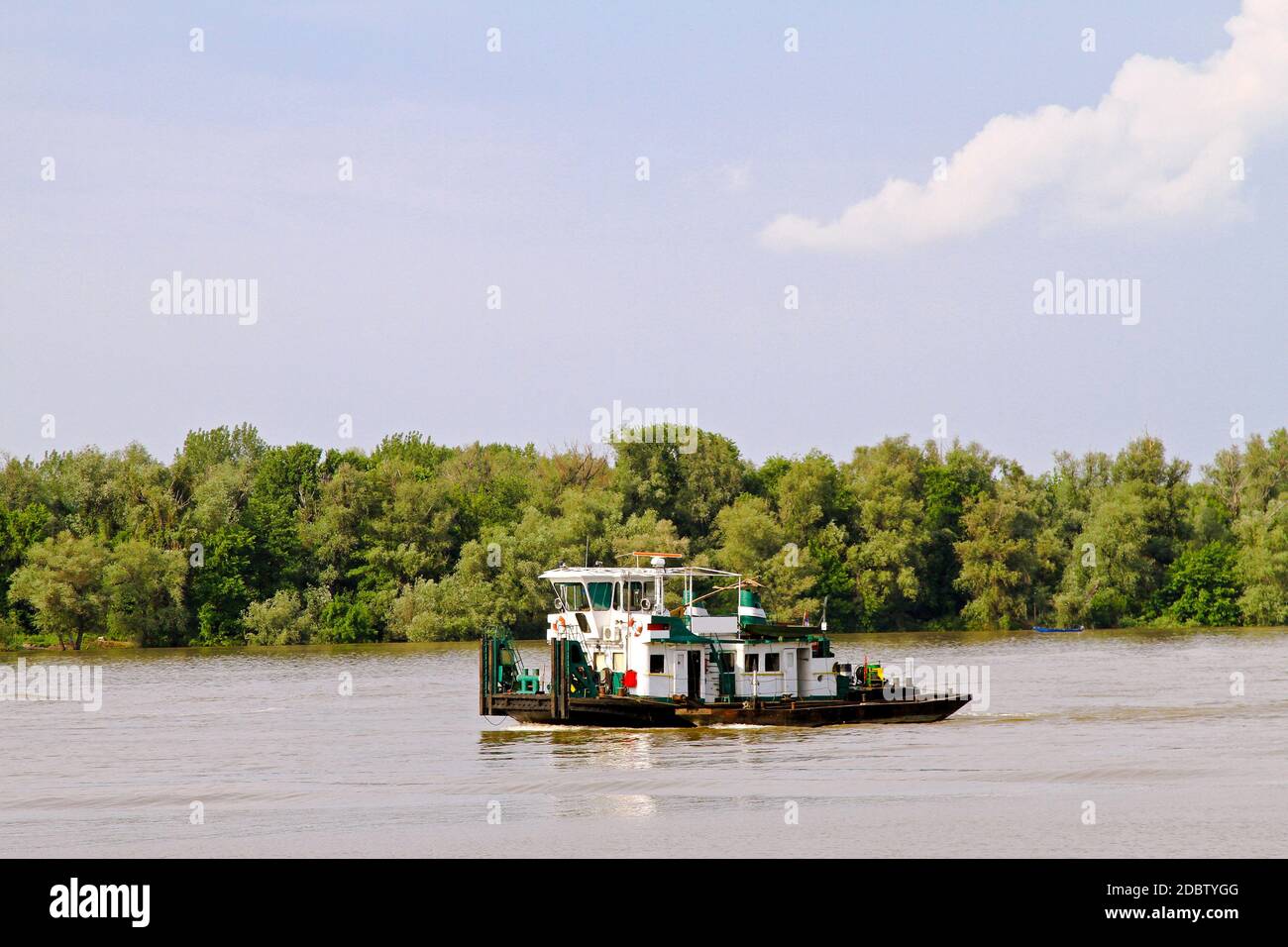 Big river tugboat surfing on the water Stock Photo - Alamy