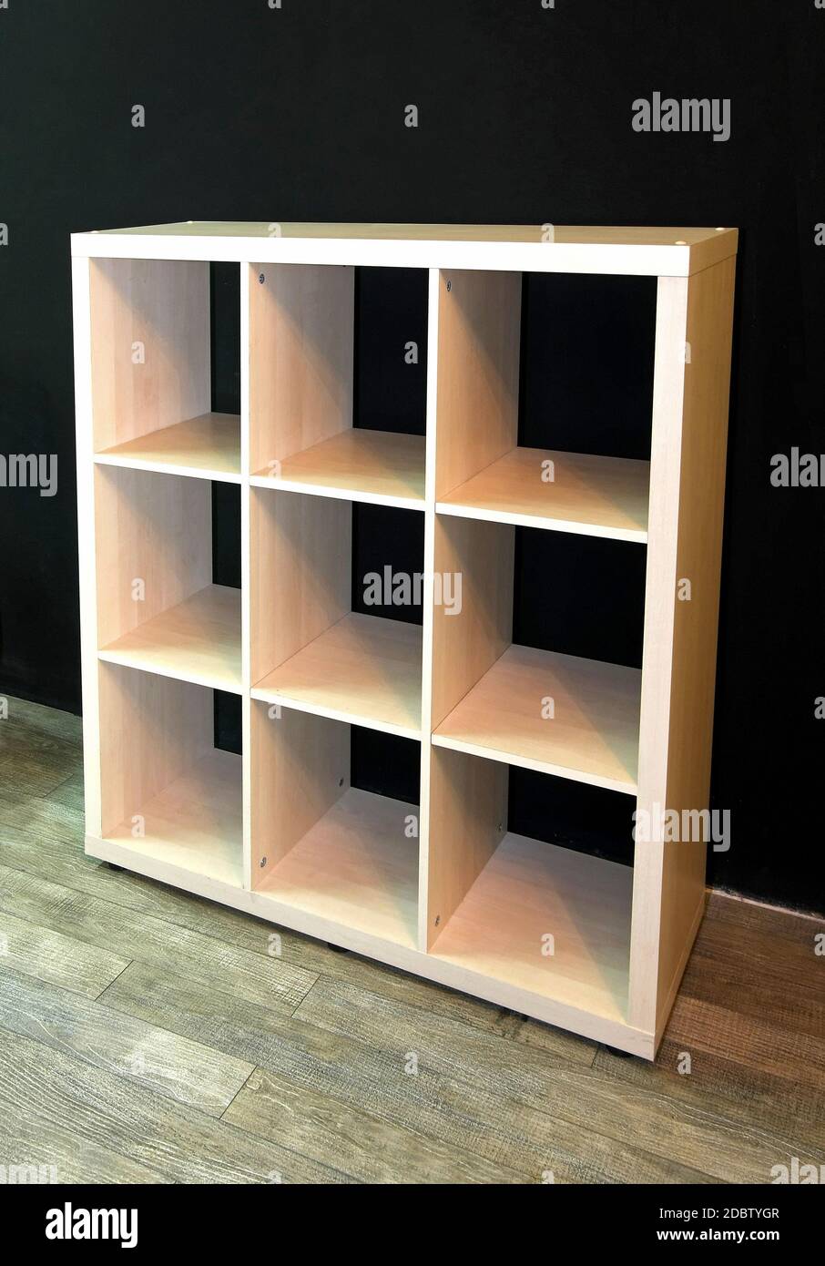 Wooden shelf with square surfaces on retro floor Stock Photo - Alamy