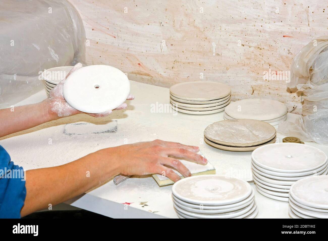 Close up shot of potter worker hands Stock Photo - Alamy