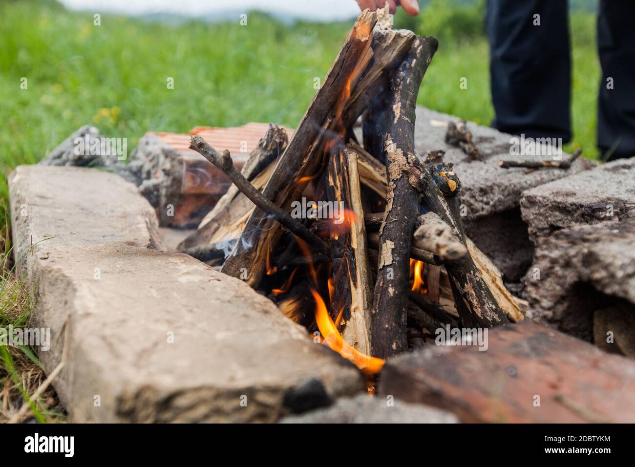 Fireplace for improvised barbecue at campsite in the nature Stock Photo ...