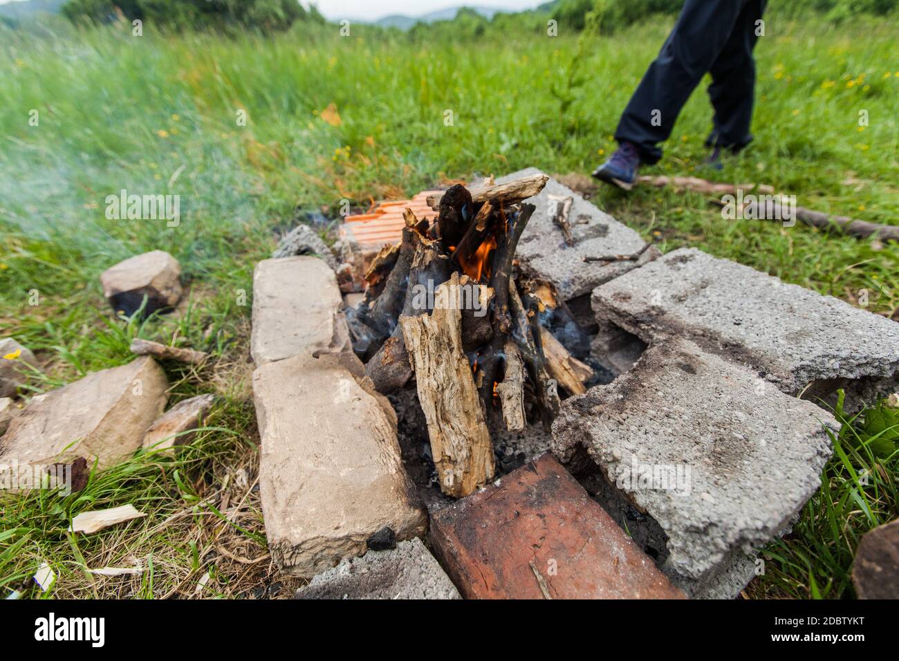 Fireplace for improvised barbecue at campsite in the nature Stock Photo ...