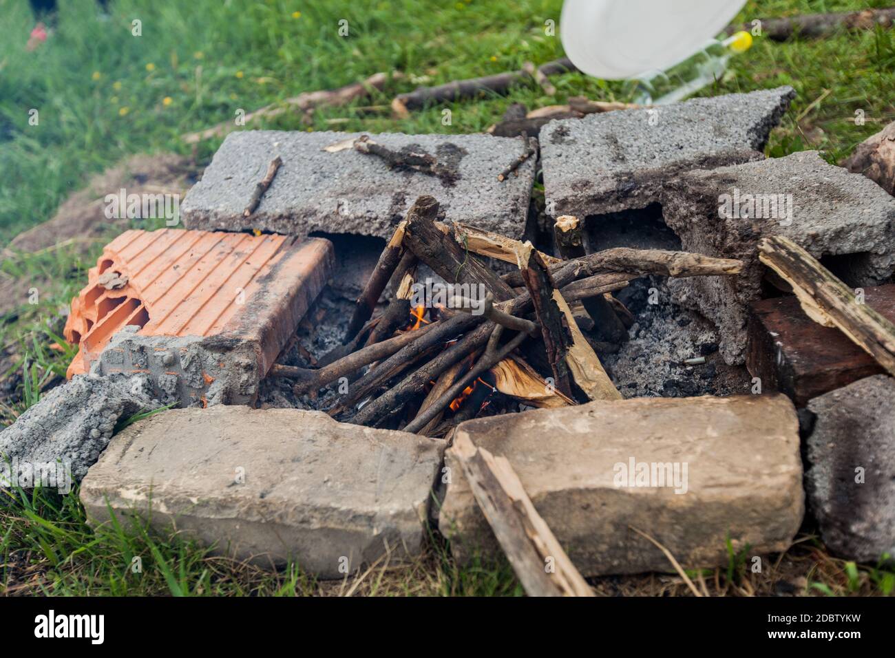 Fireplace for improvised barbecue at campsite in the nature Stock Photo ...