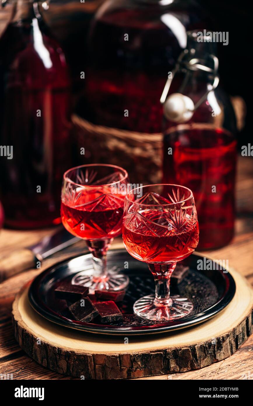 Homemade berry liqueur in rustic setting Stock Photo - Alamy