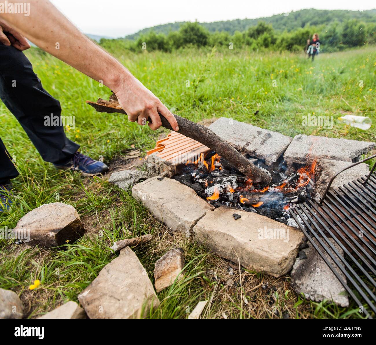 Fireplace for improvised barbecue at campsite in the nature Stock Photo ...