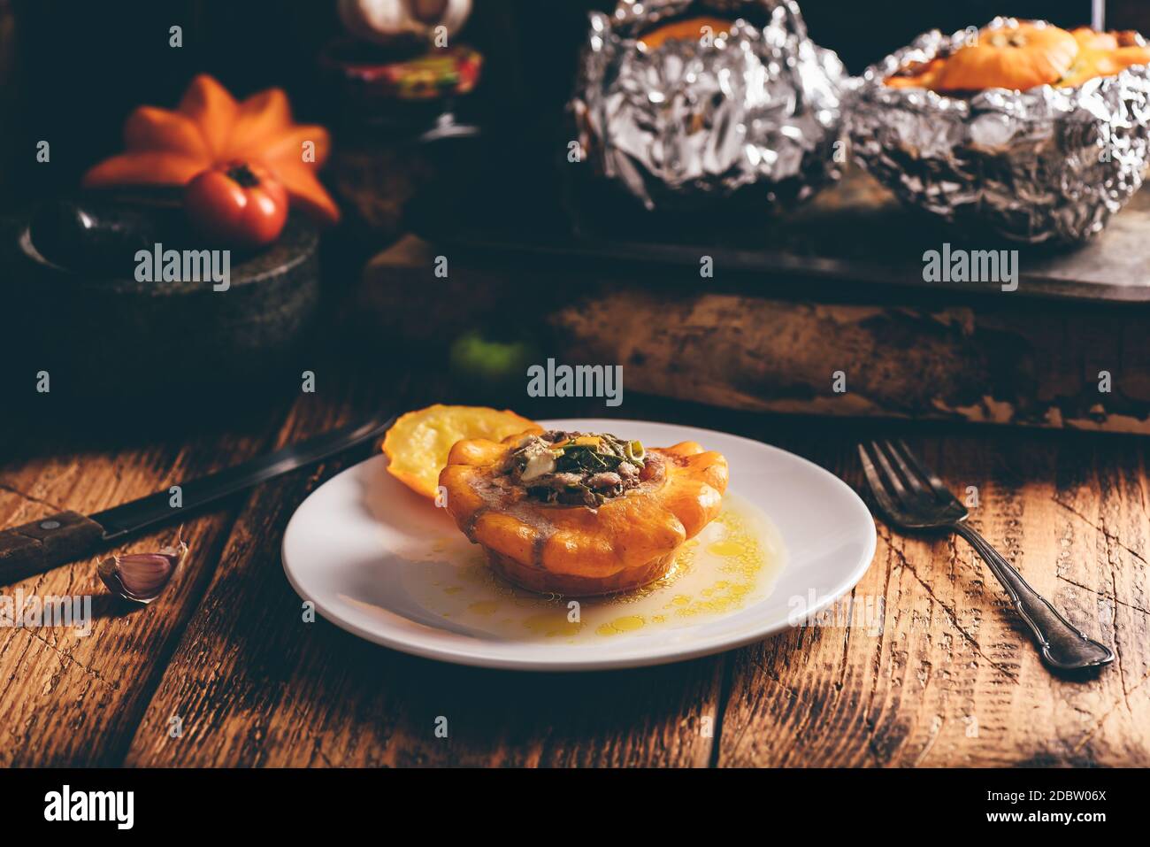 Baked pattypan squash with minced meat and vegetables Stock Photo - Alamy