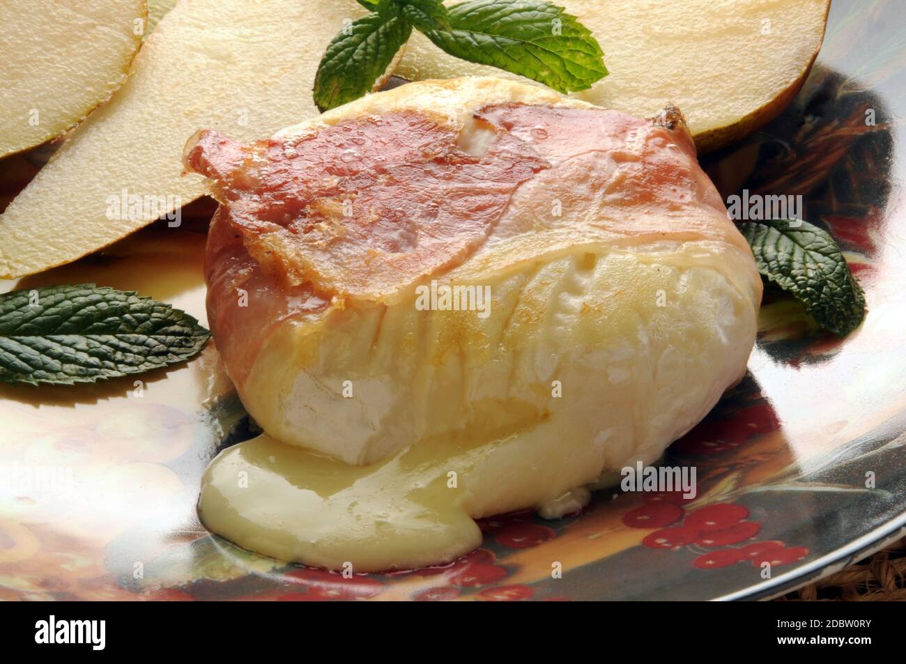 Traditional italian cheese tomino with bacon Stock Photo - Alamy