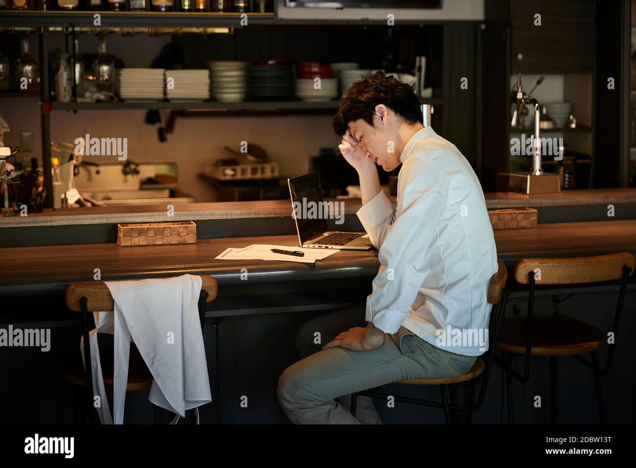 Japanese Chef Depressed In His Restaurant Stock Photo - Alamy