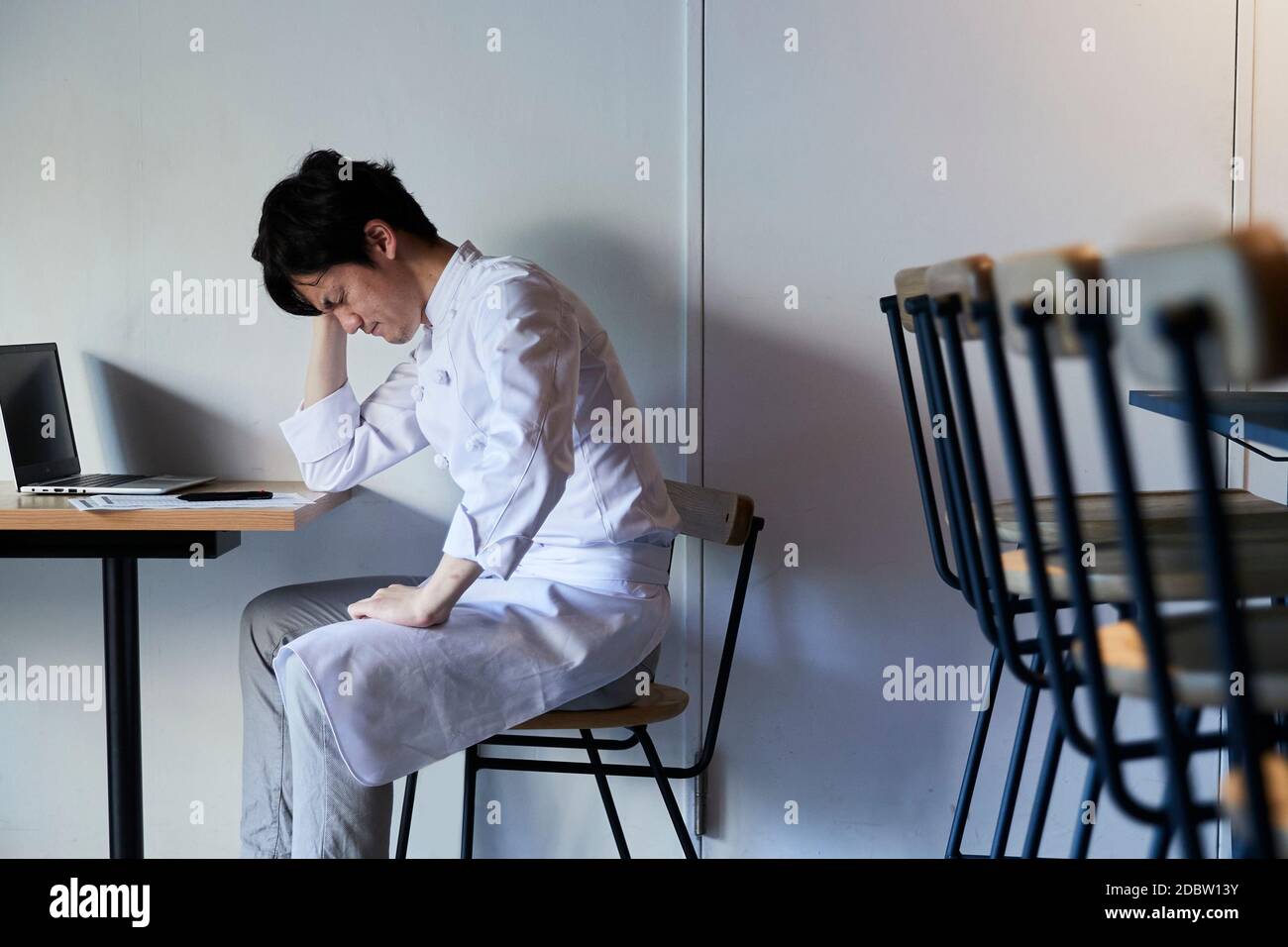 Japanese Chef Depressed In His Restaurant Stock Photo - Alamy