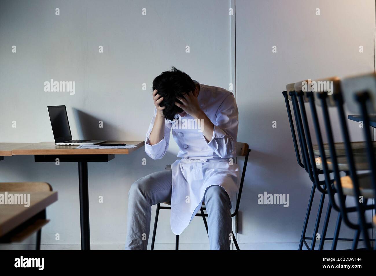 Japanese Chef Depressed In His Restaurant Stock Photo - Alamy