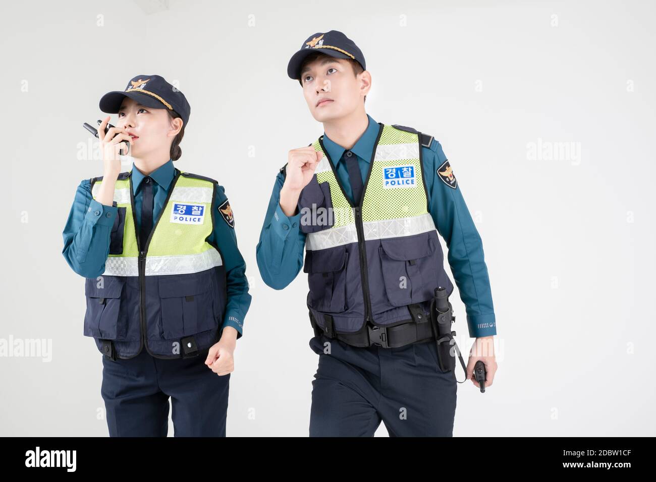 Asian male and female two police officers 094 Stock Photo - Alamy
