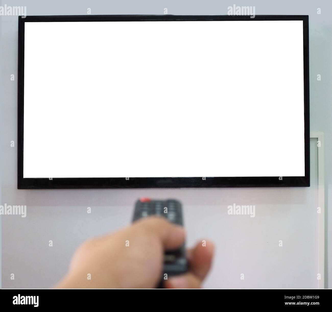 Empty TV screen and the hand is holding the remote control to change ...