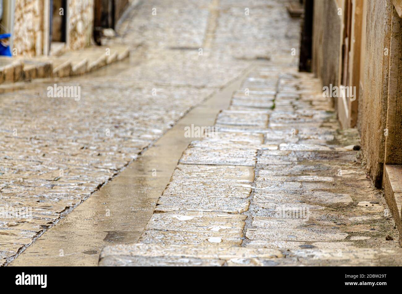 Detail of an ancient Sicilian stone road Stock Photo - Alamy