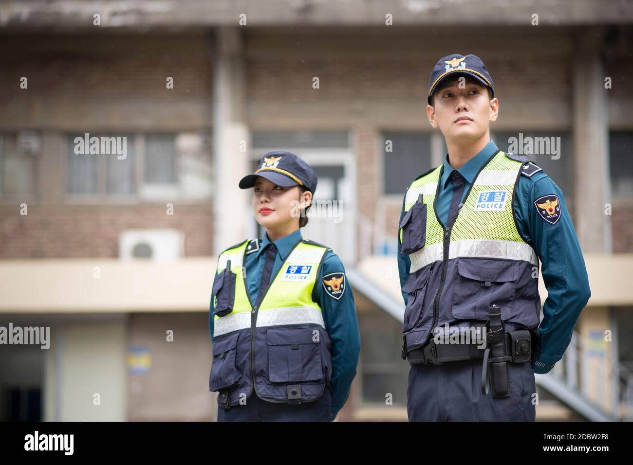 Asian male and female two police officers 108 Stock Photo - Alamy