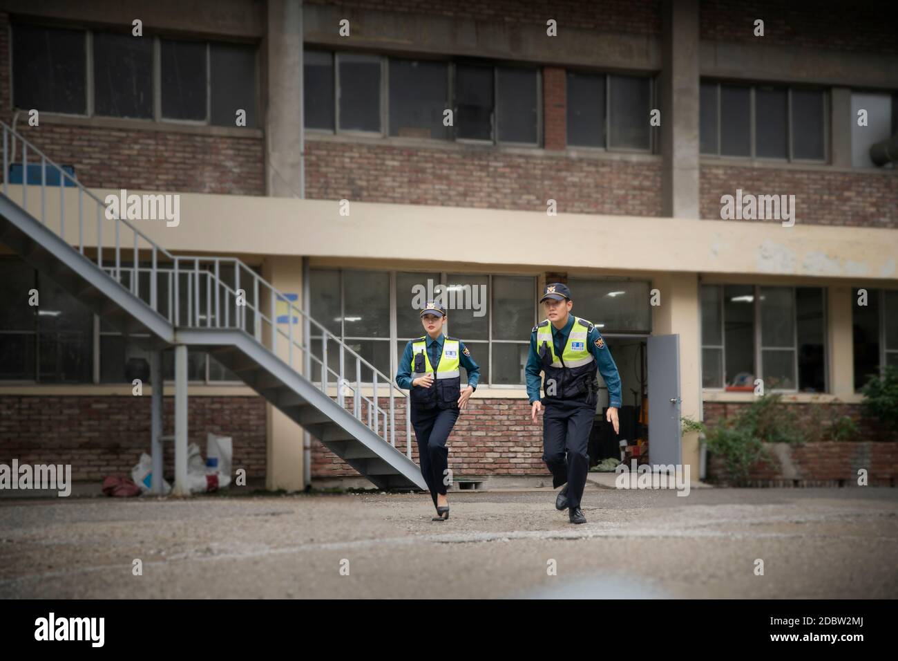 Asian male and female two police officers 112 Stock Photo - Alamy