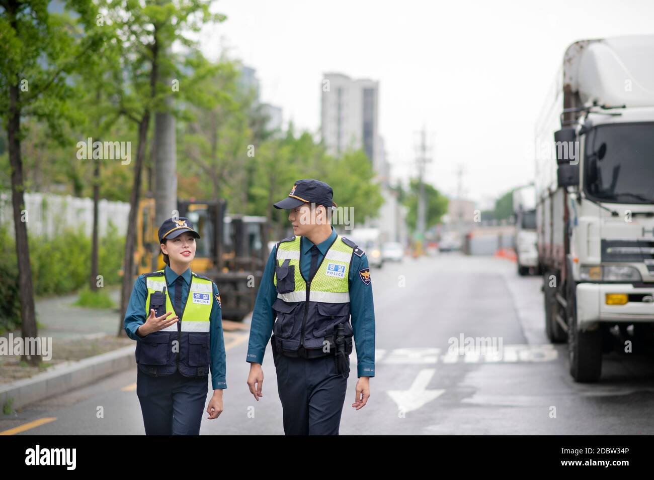 Asian male and female two police officers 117 Stock Photo - Alamy