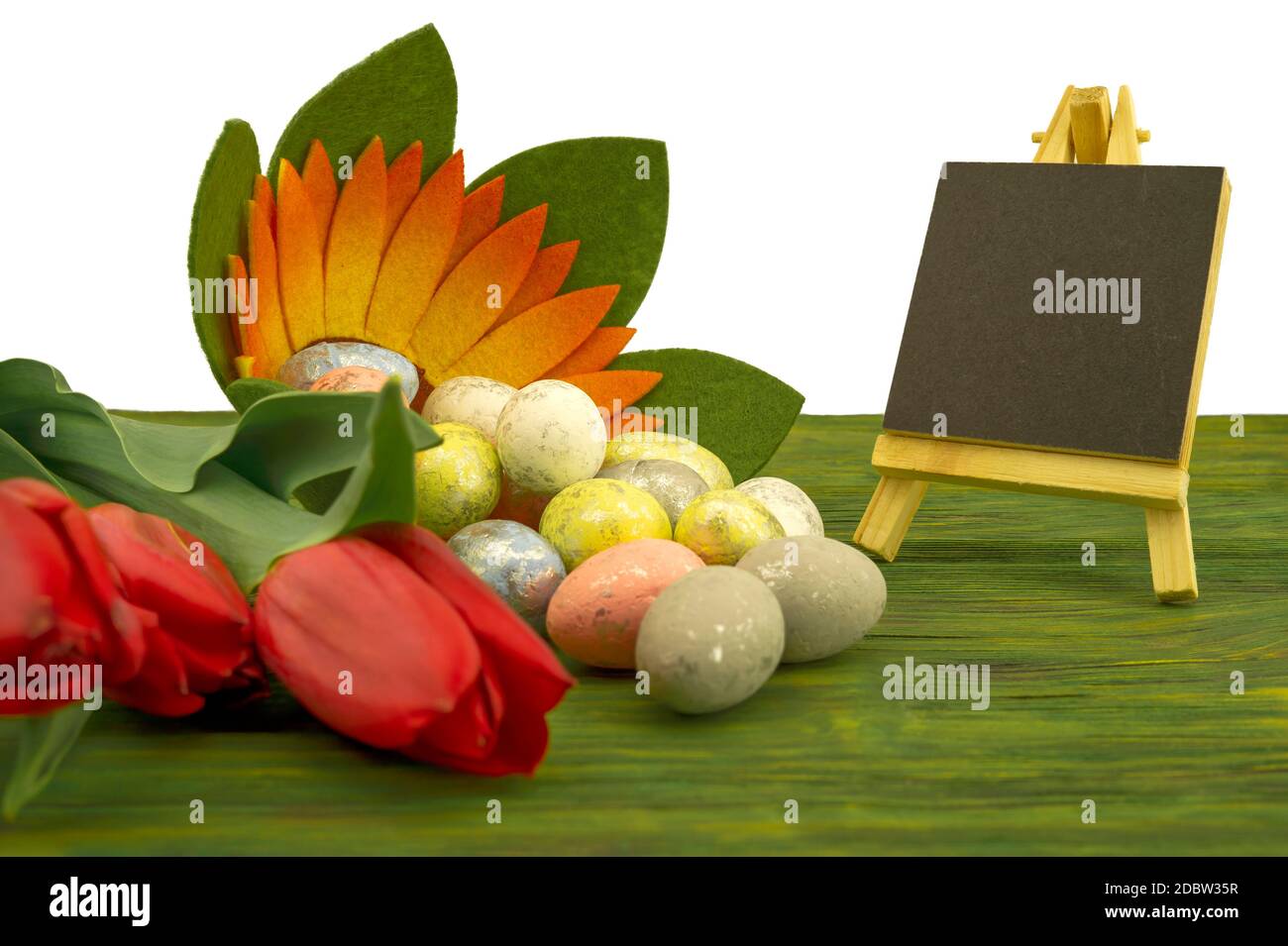 Easter background. Red spring tulips and painted eggs on vintage wooden ...