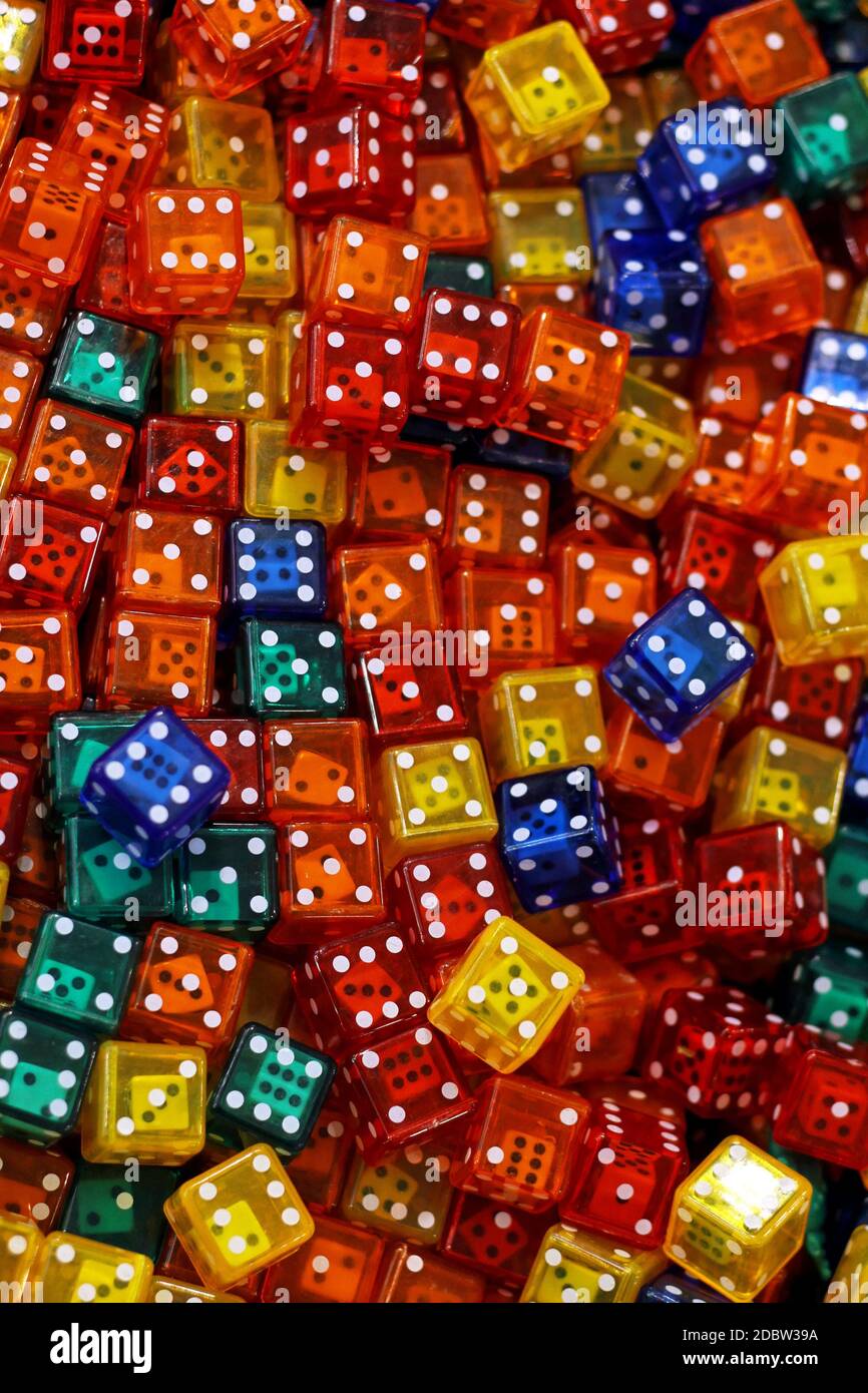 Big pile of plastic colorful dices with another dice inside Stock Photo ...