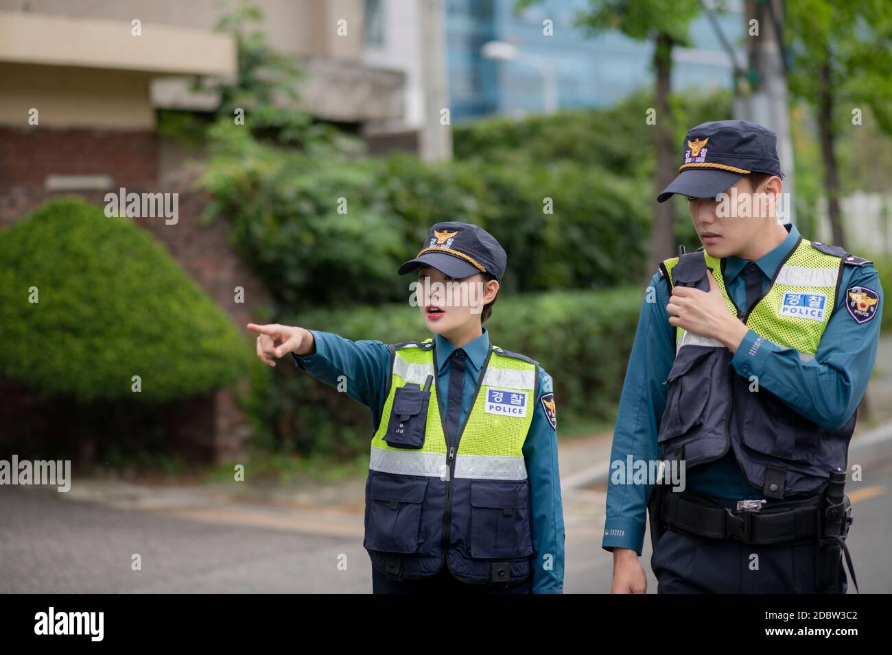 Asian male and female two police officers 118 Stock Photo - Alamy