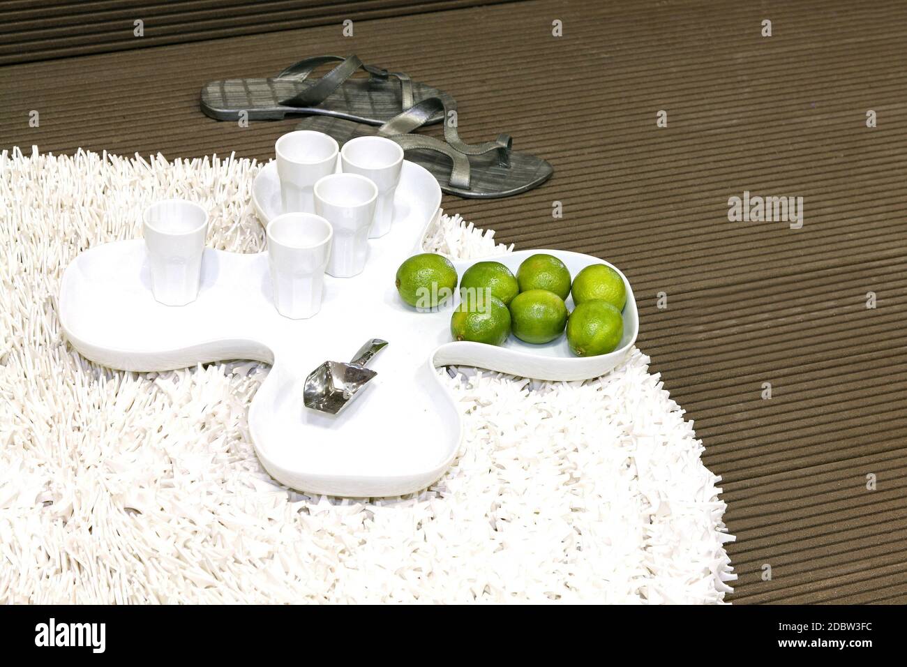 Rubber slippers and lemonade tray in the garden by the pool Stock Photo ...