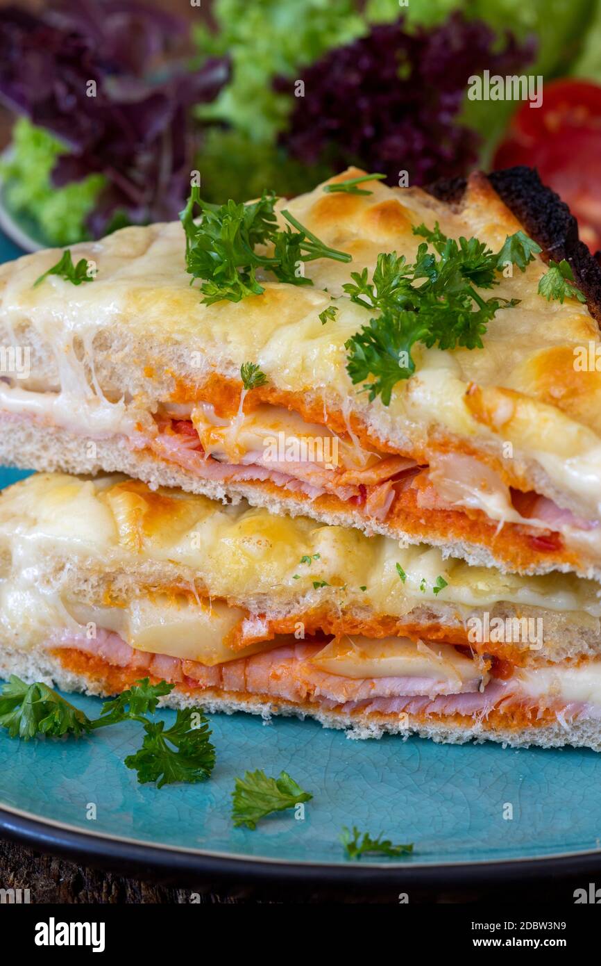 french croque monsieur on a blue plate Stock Photo - Alamy