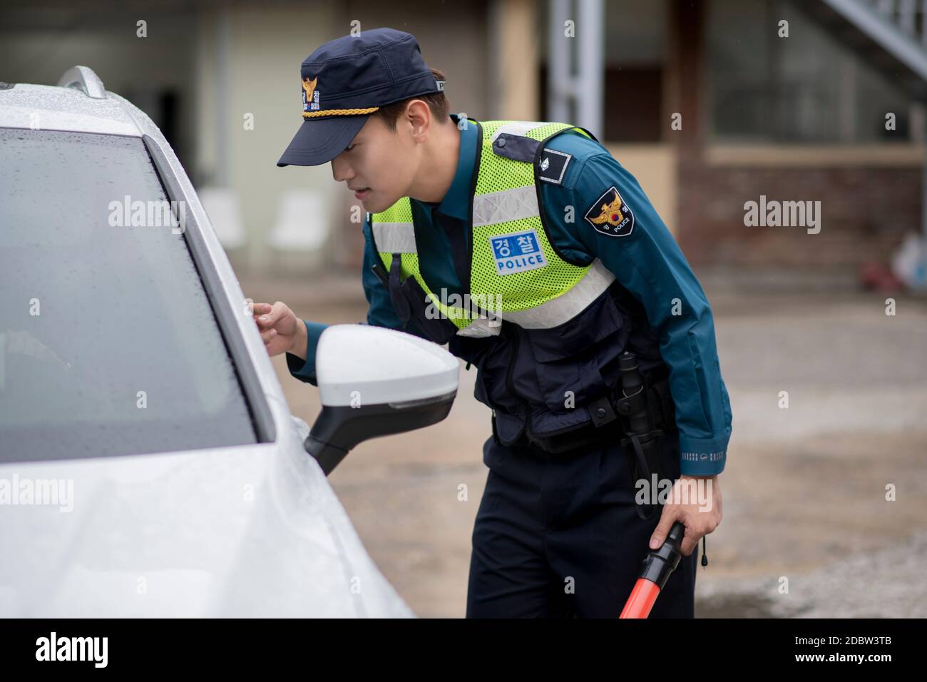 Two young talking to policeman hi-res stock photography and images - Alamy