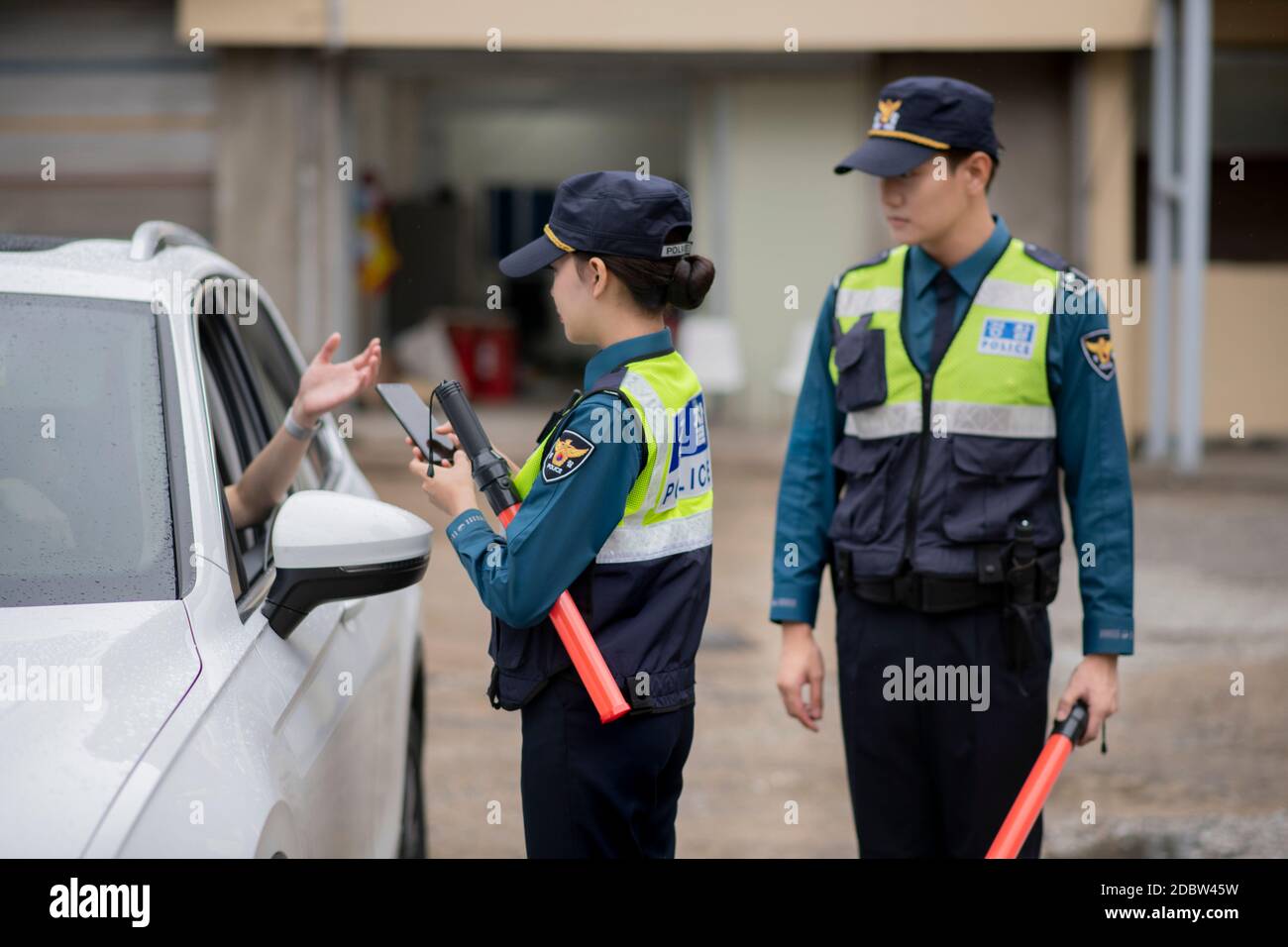 Asian male and female two police officers 125 Stock Photo - Alamy