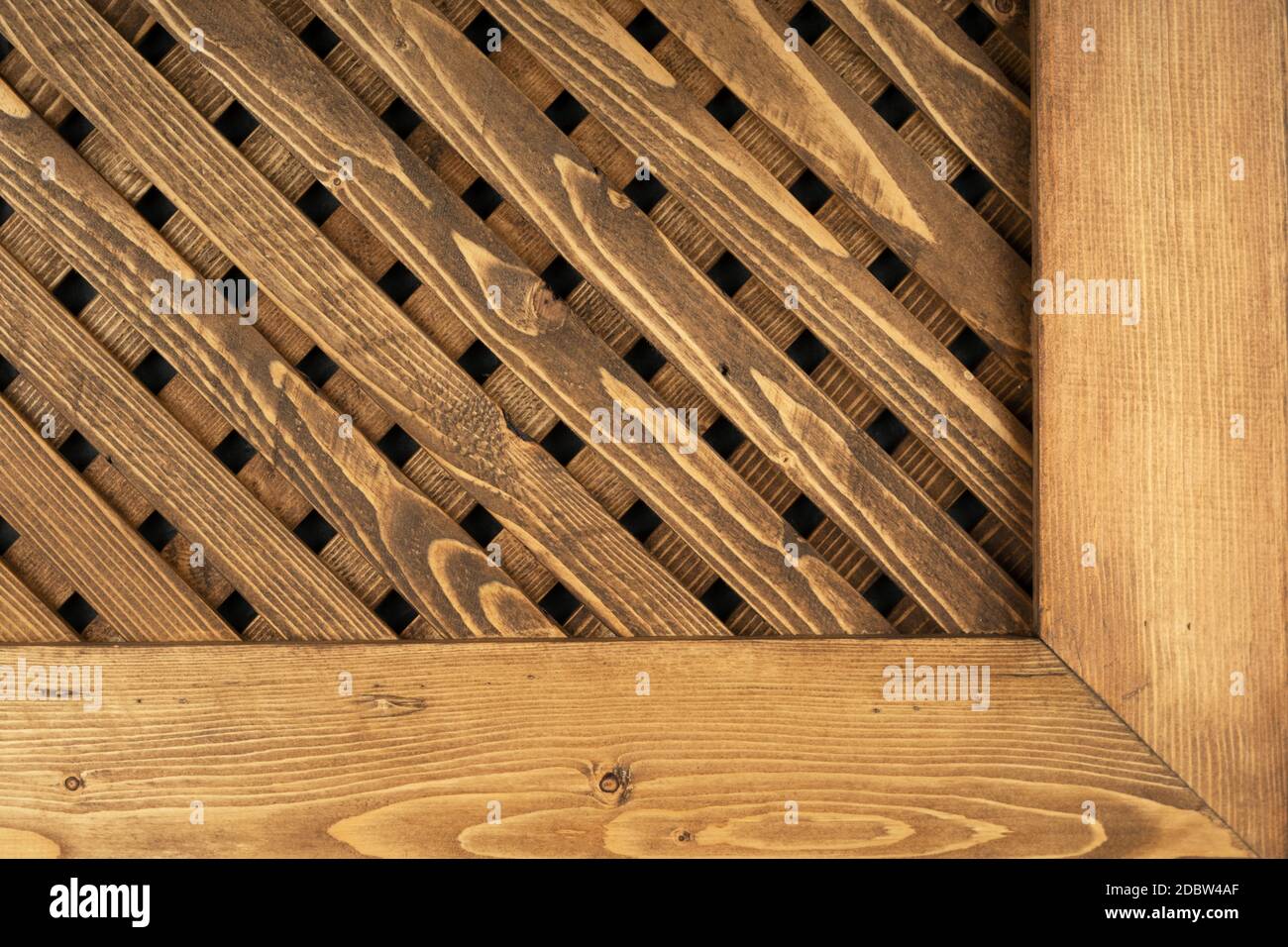 Texture of the wooden lattice. Natural wooden diagonal lattice. Close ...