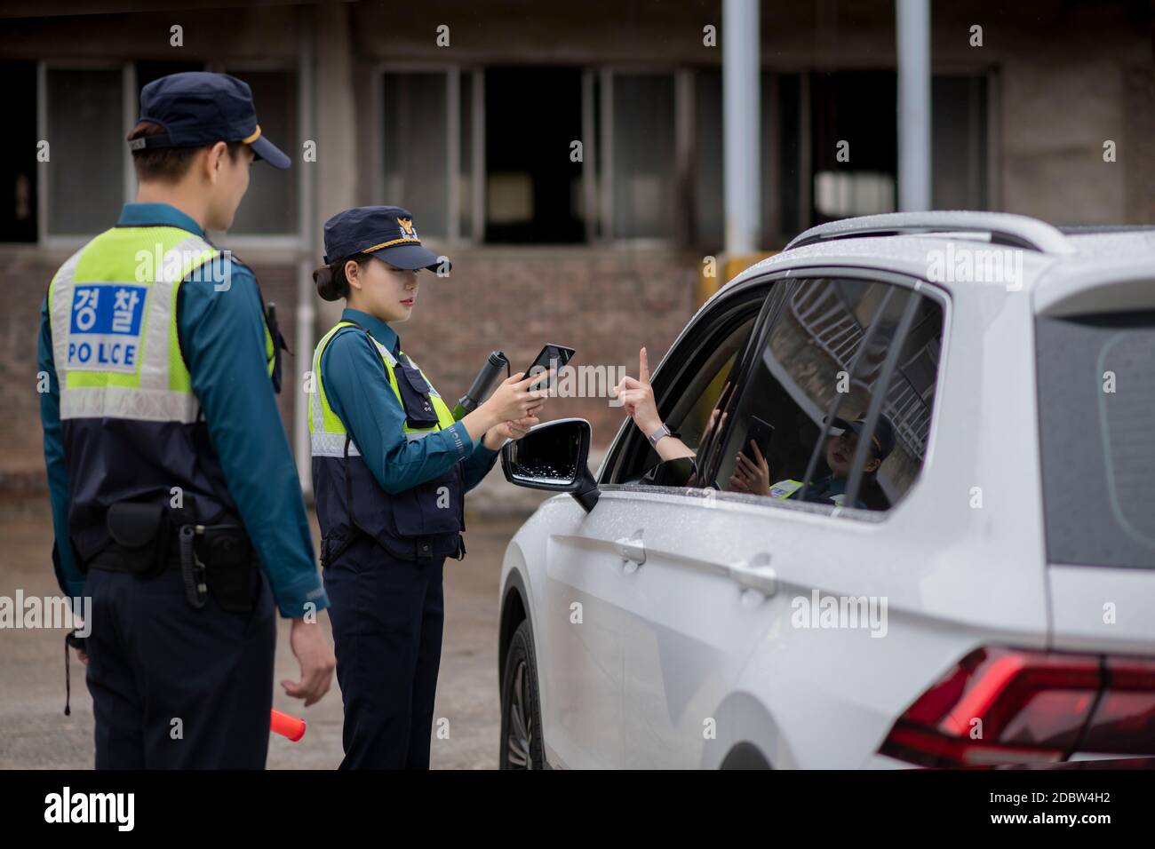 Two young talking to policeman hi-res stock photography and images - Alamy