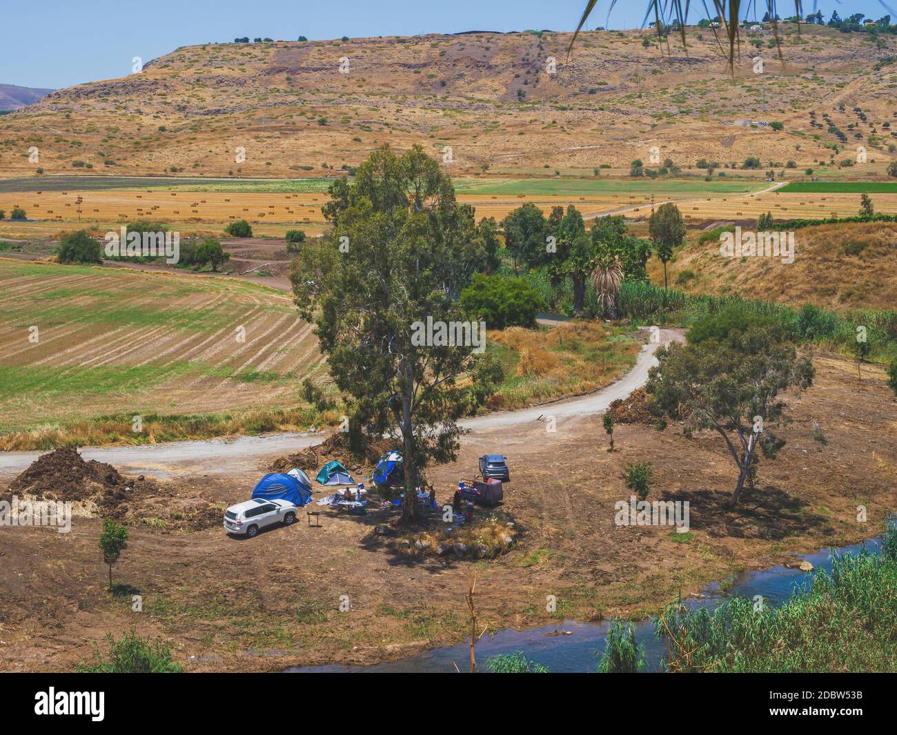 Landscape of country area of Jordan Valley in Israel with a group of ...