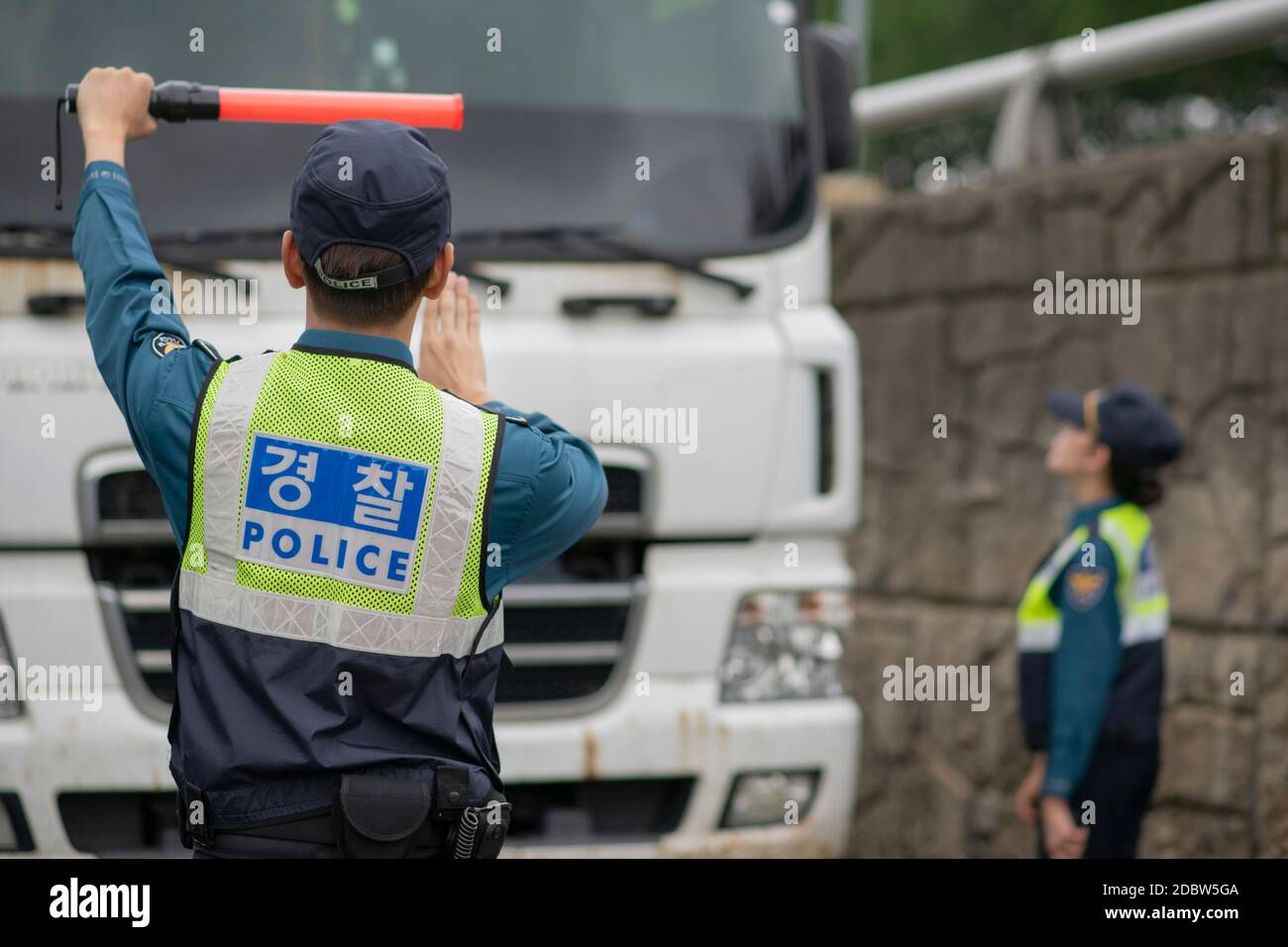 Asian male and female two police officers 137 Stock Photo - Alamy