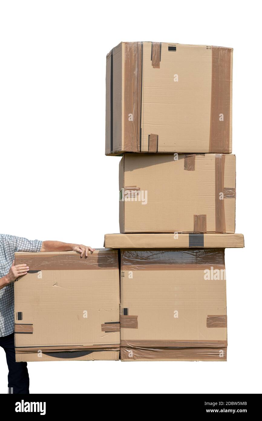 A large stack of cardboard boxes is carried by a delivery person is ...
