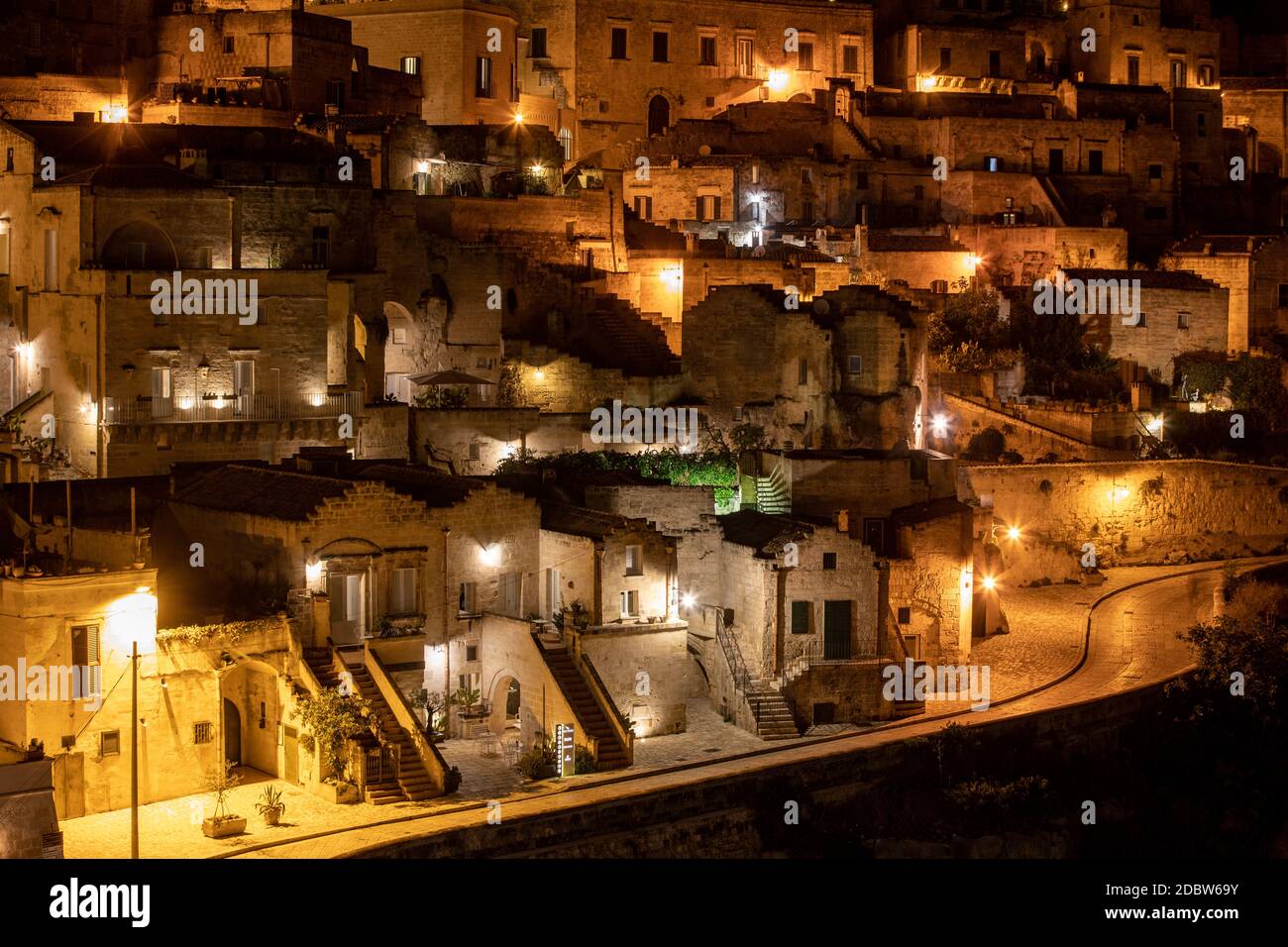 Amazing lighted buildings in ancient Sassi district by night in Matera ...
