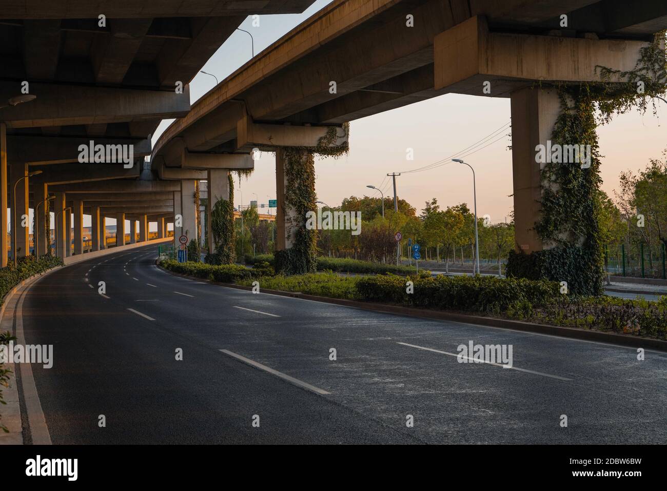 Urban road under overpass bridge Stock Photo - Alamy