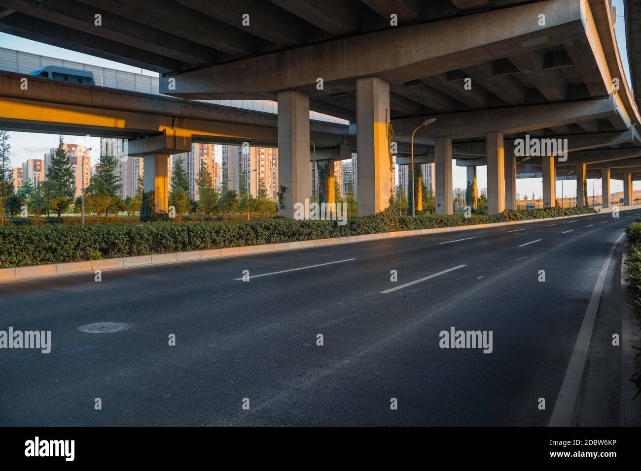 Urban road under overpass bridge Stock Photo - Alamy