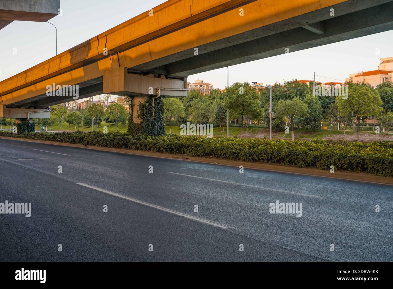 Urban road under overpass bridge Stock Photo - Alamy