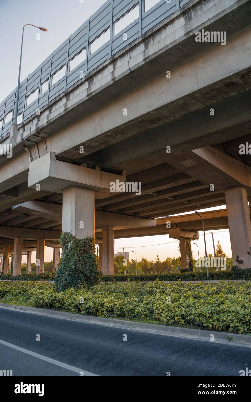 Urban road under overpass bridge Stock Photo - Alamy