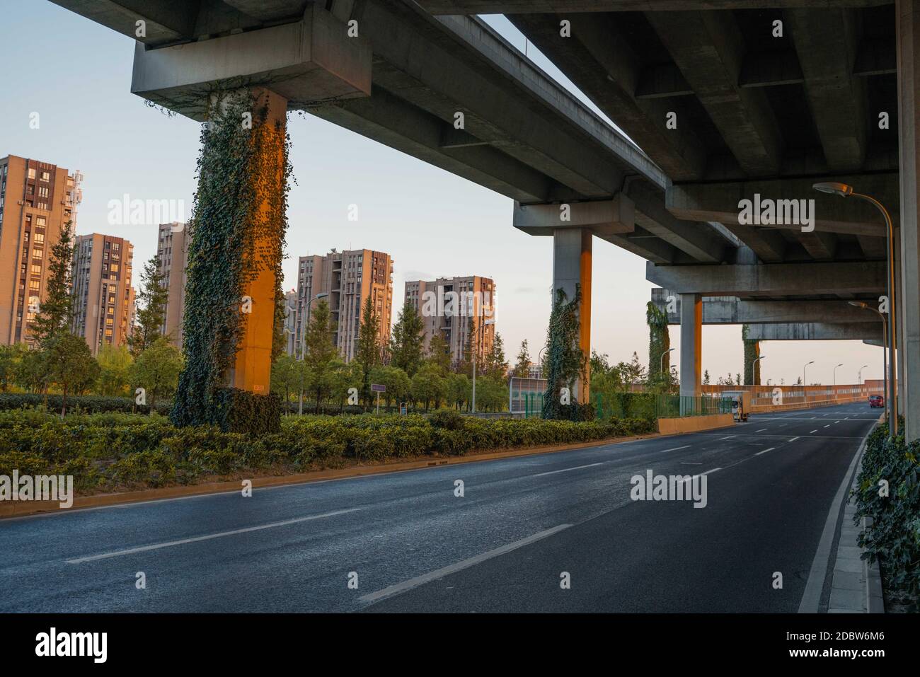 Urban road under overpass bridge Stock Photo - Alamy